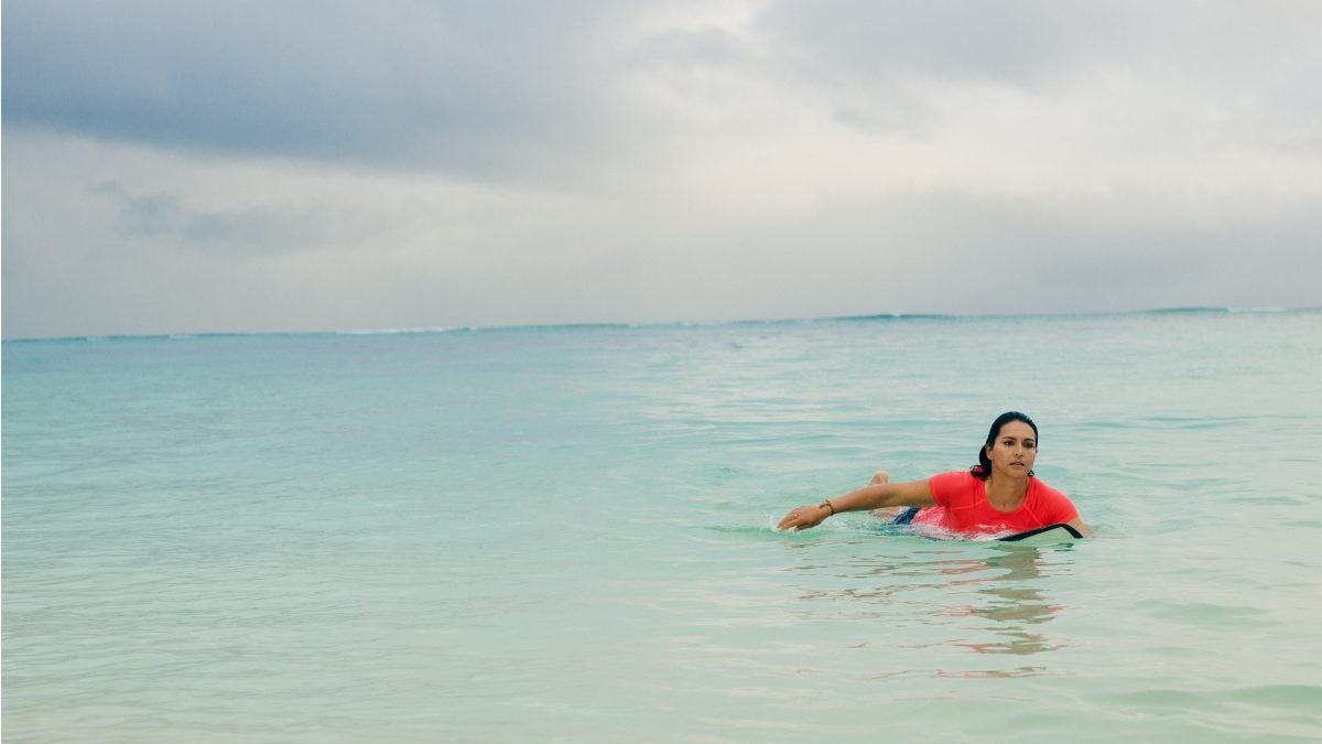 A Hawaiian Congresswoman Paddles into a Wave... | Outside Online